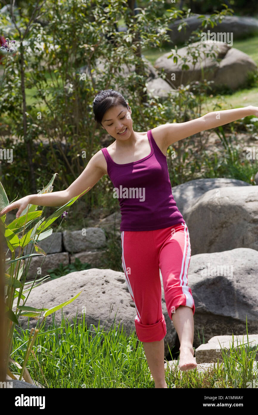 Woman carefully walking barefoot outdoors Stock Photo - Alamy