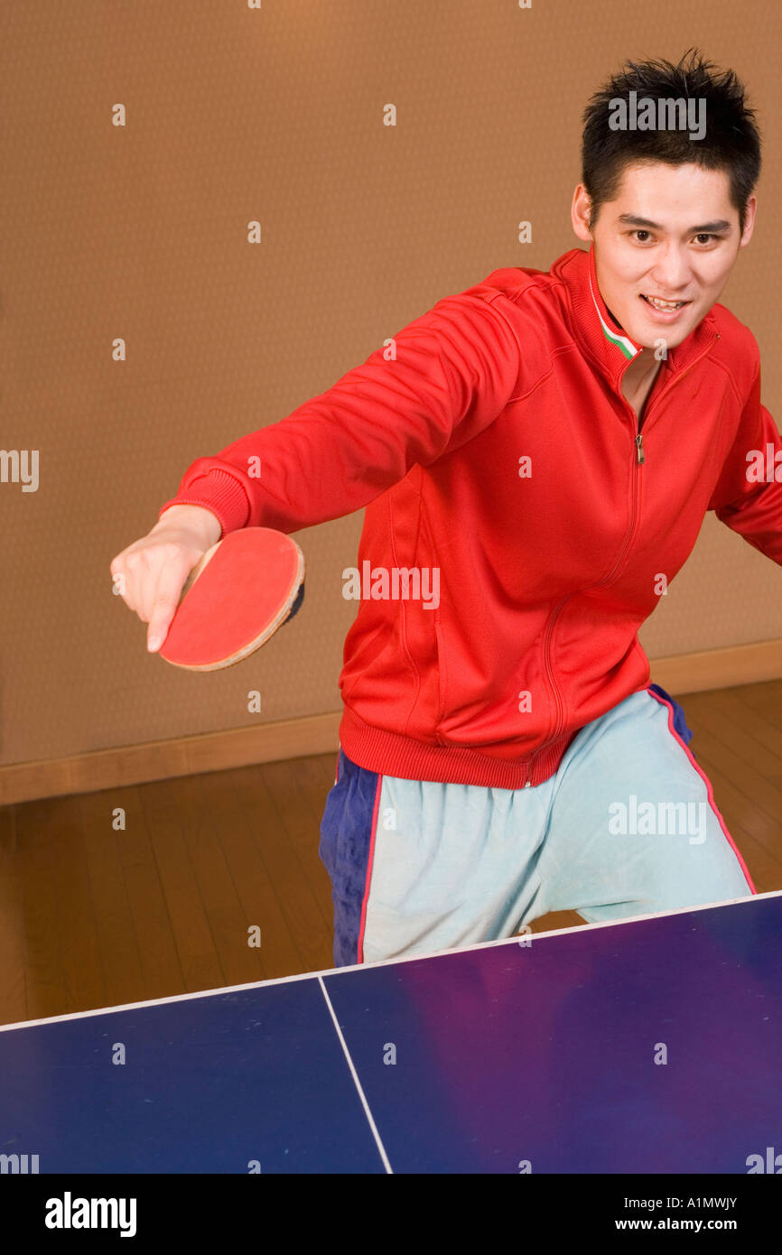 Young man playing table tennis Stock Photo - Alamy