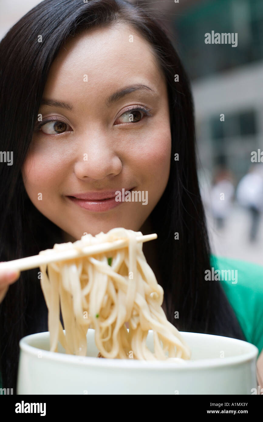 Chinese girls eating noodles hi-res stock photography and images - Alamy