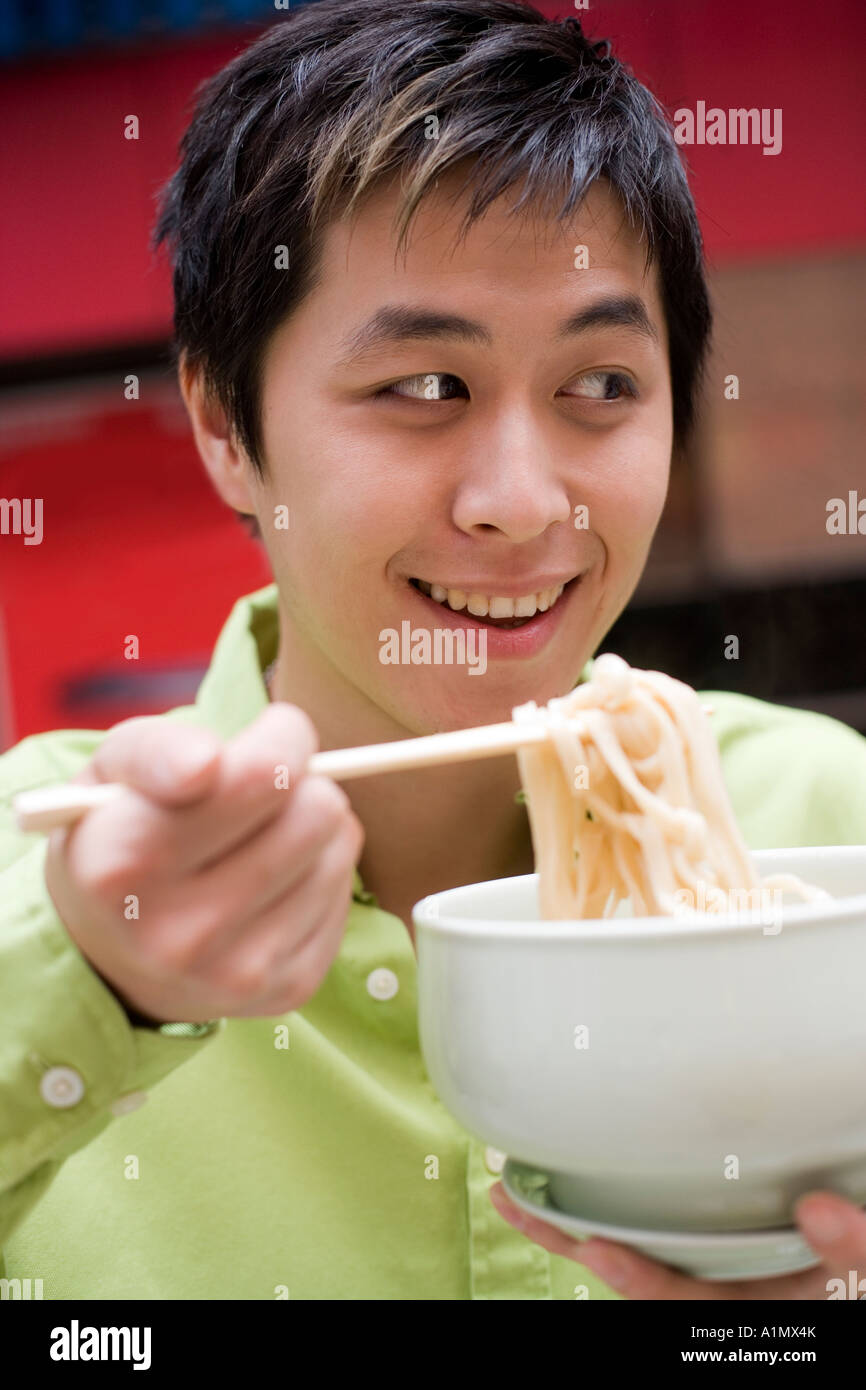Chinese boy eating noodle soup hi-res stock photography and images - Alamy