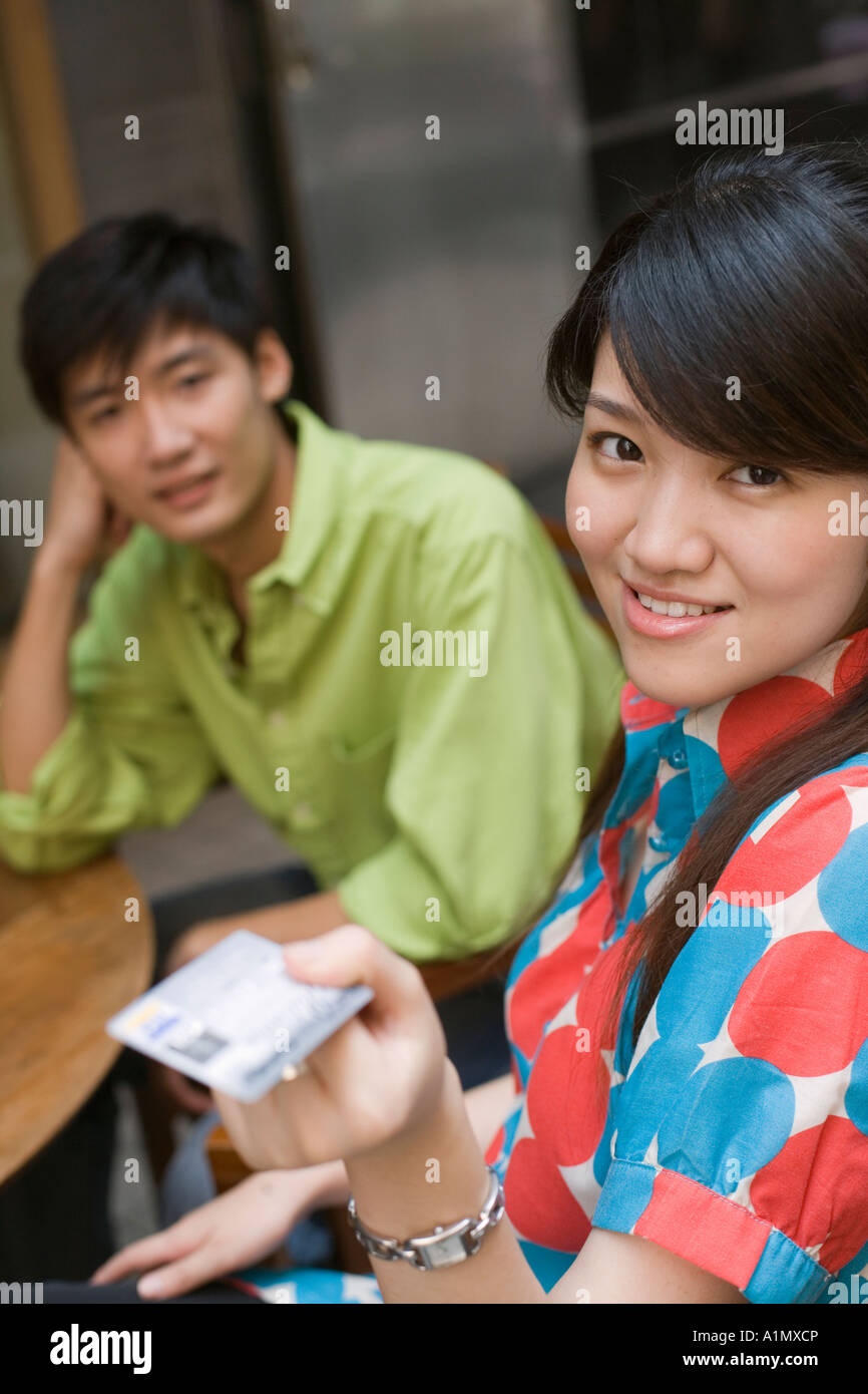 Young woman displaying an identification card Stock Photo - Alamy