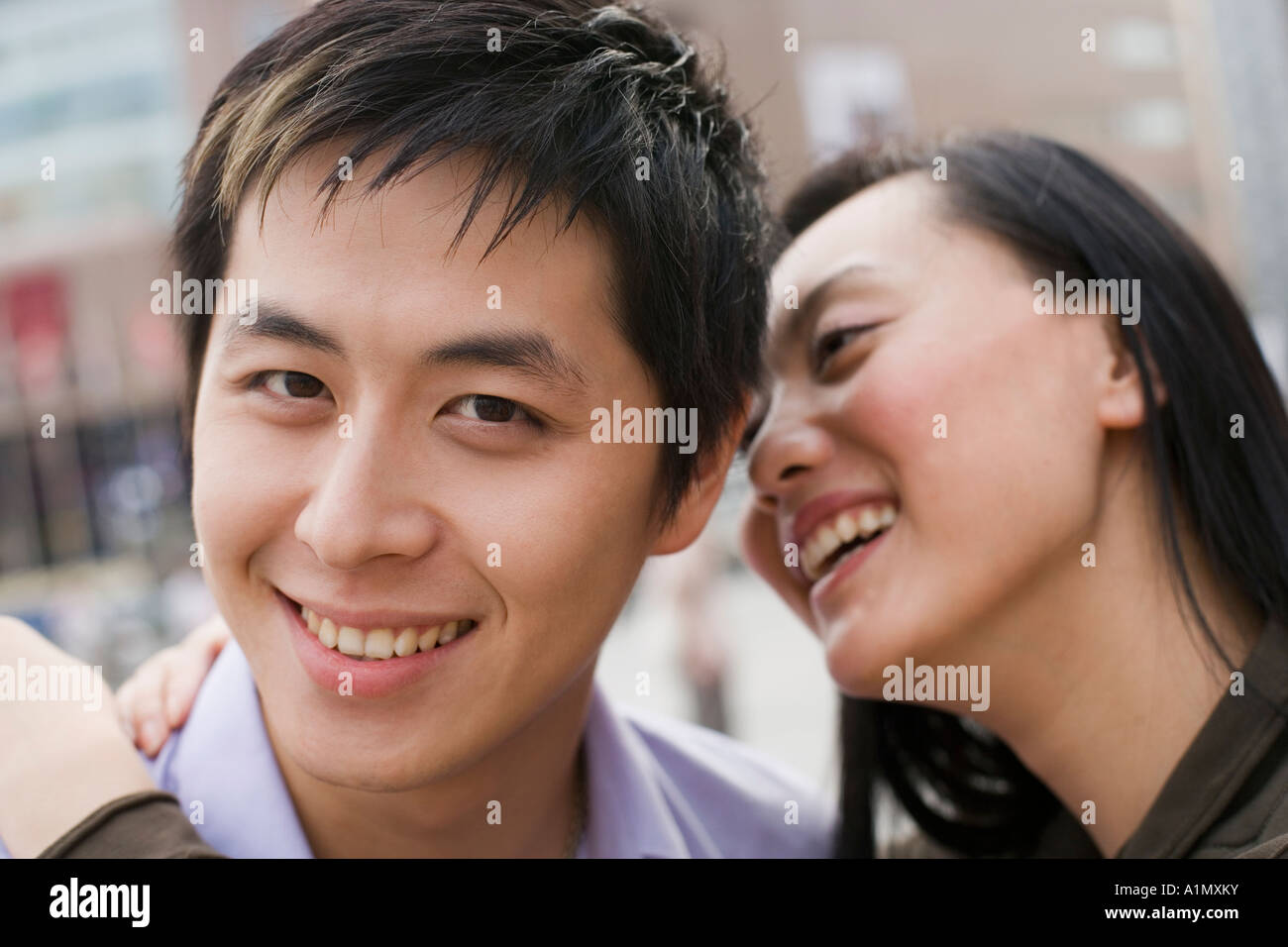 Young couple smiling together Stock Photo - Alamy