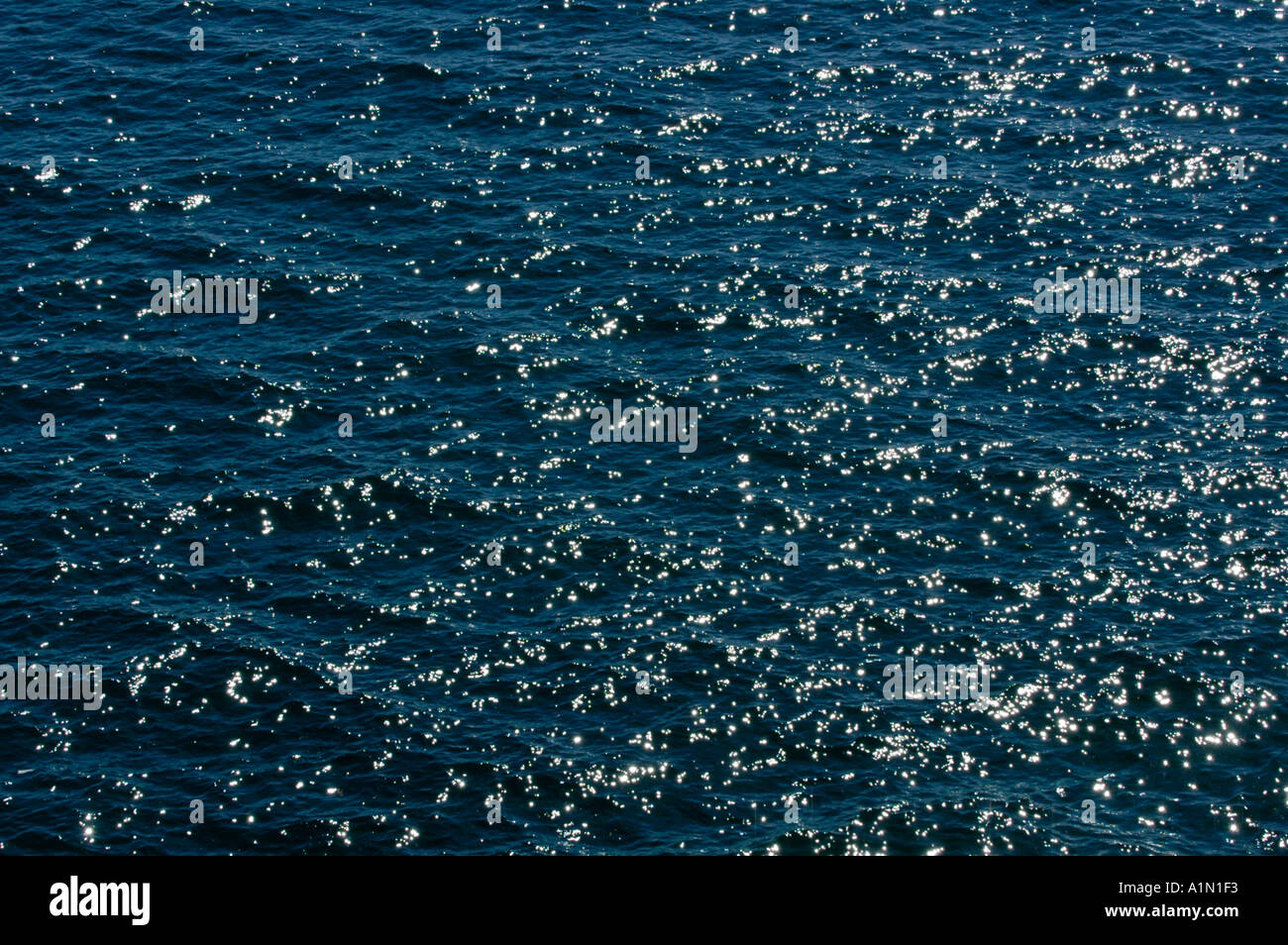 deep blue surface reflection of sunrays Stock Photo - Alamy