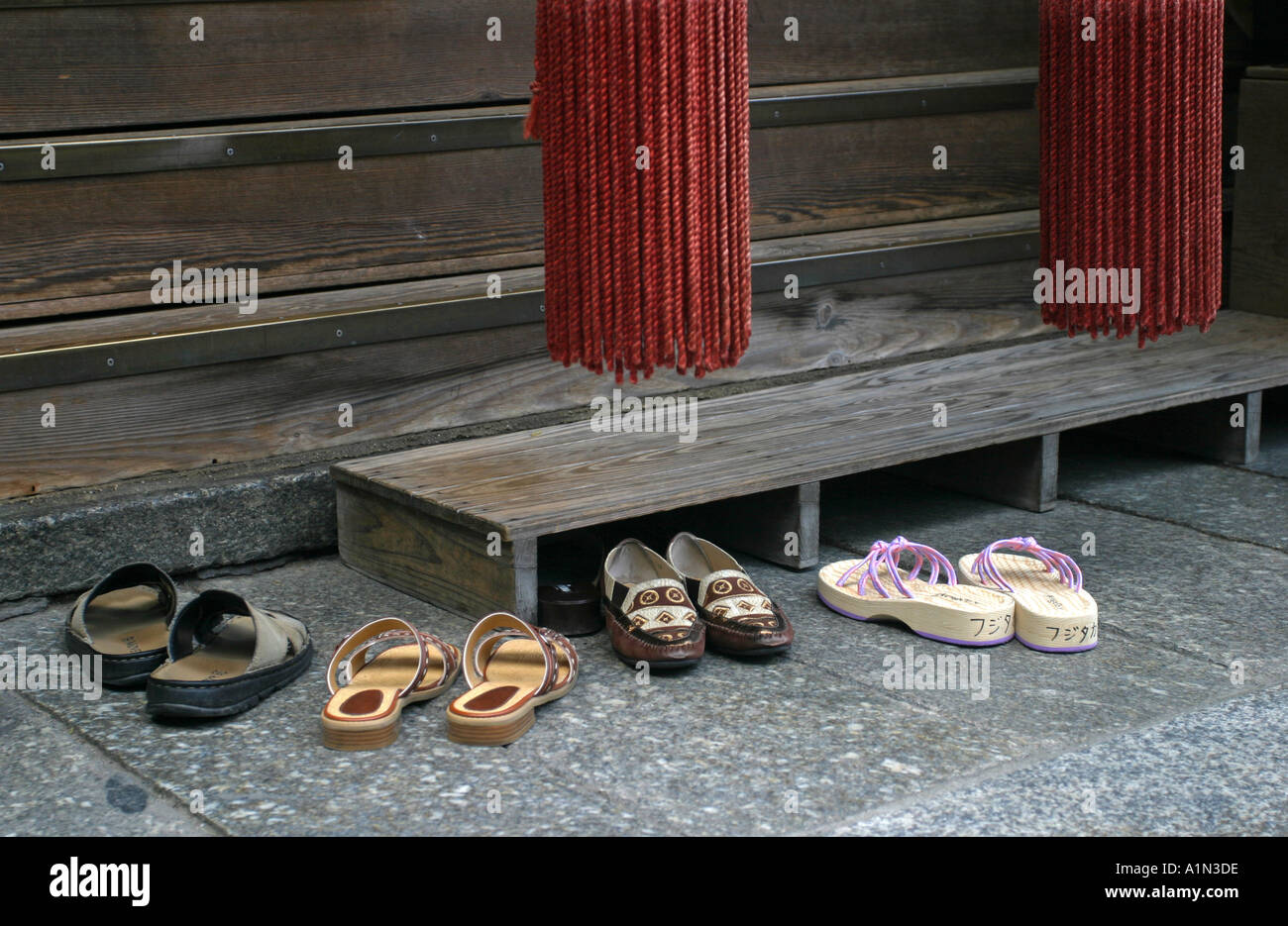 Discarded shoes at the entrance to a temple building at Hozanji temple ...