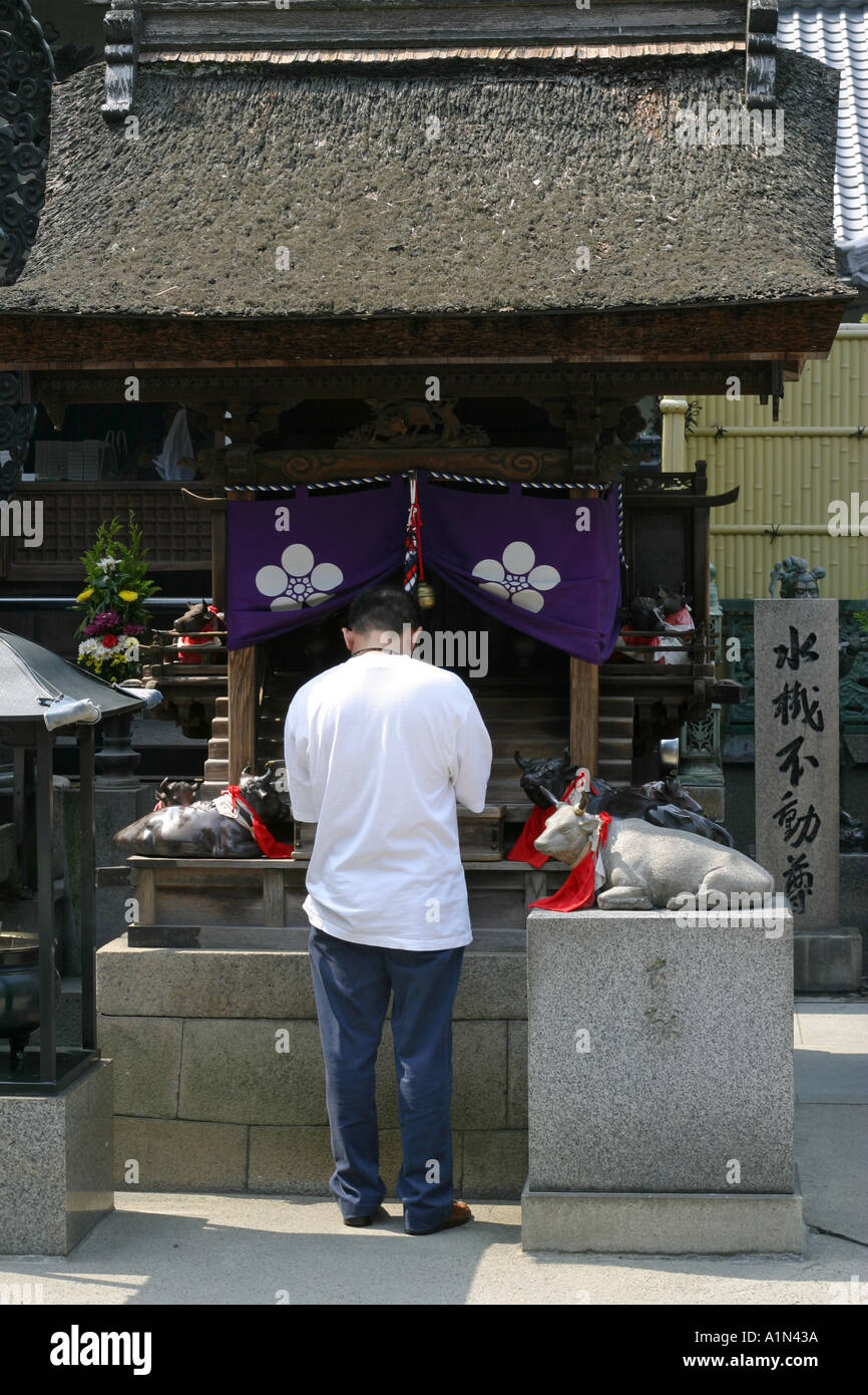 Buddhist Japanese man prays at Hozanji temple Nara Japan Asia Stock ...