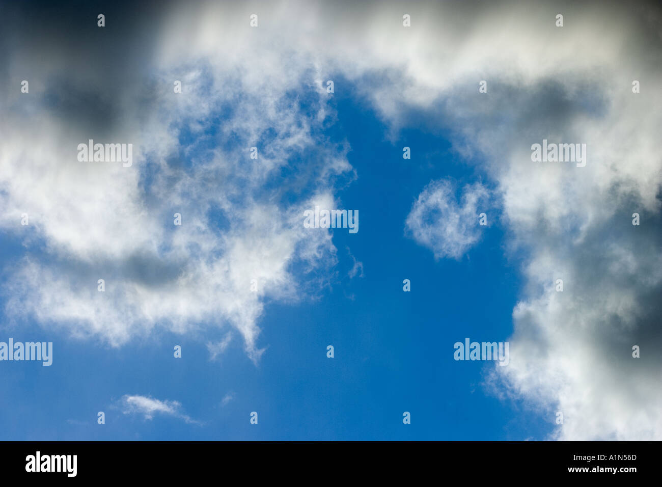Changing cloud formations against a blue sky Stock Photo - Alamy