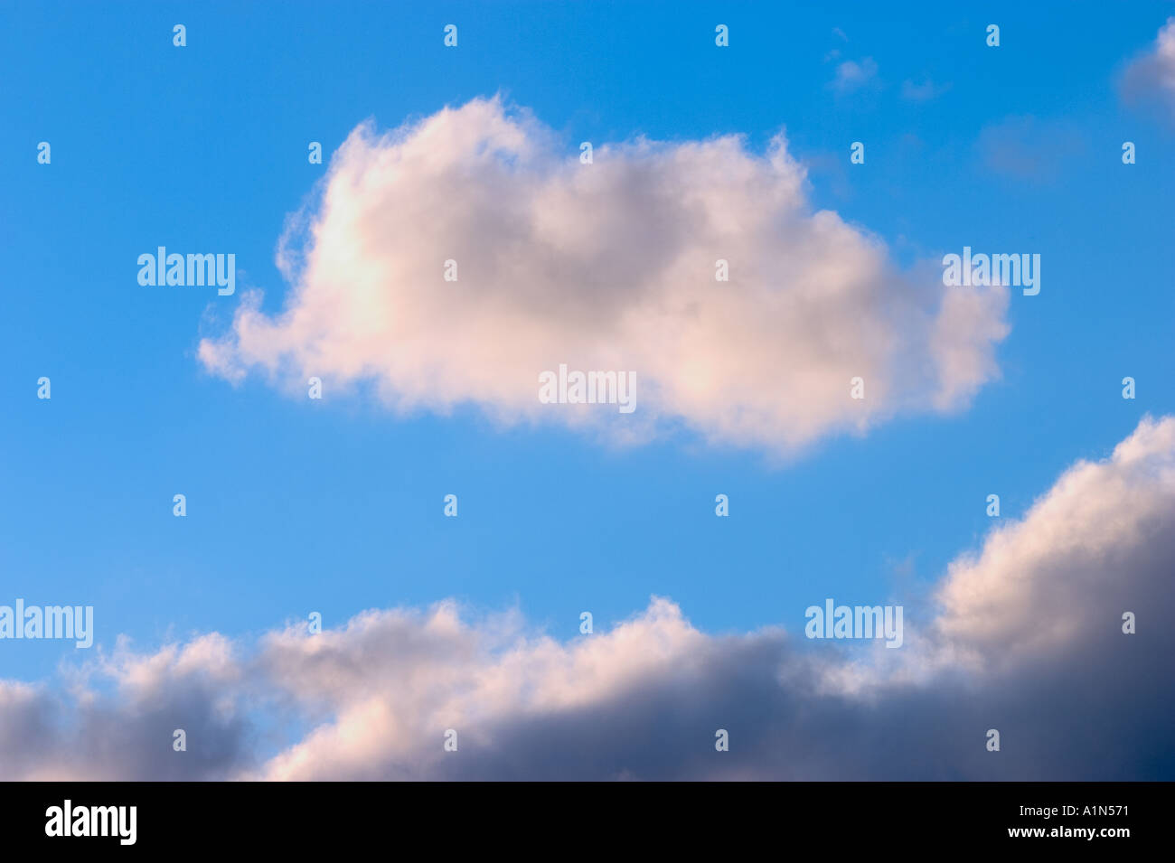 Changing cloud formations against a blue sky Stock Photo - Alamy