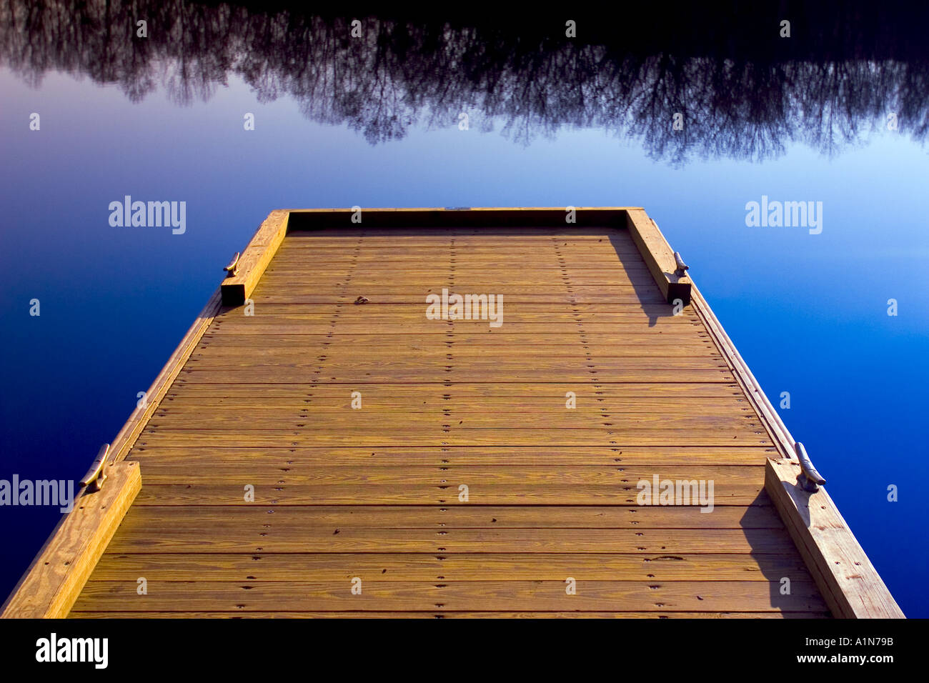 Empty boat dock at sunrise Stock Photo - Alamy