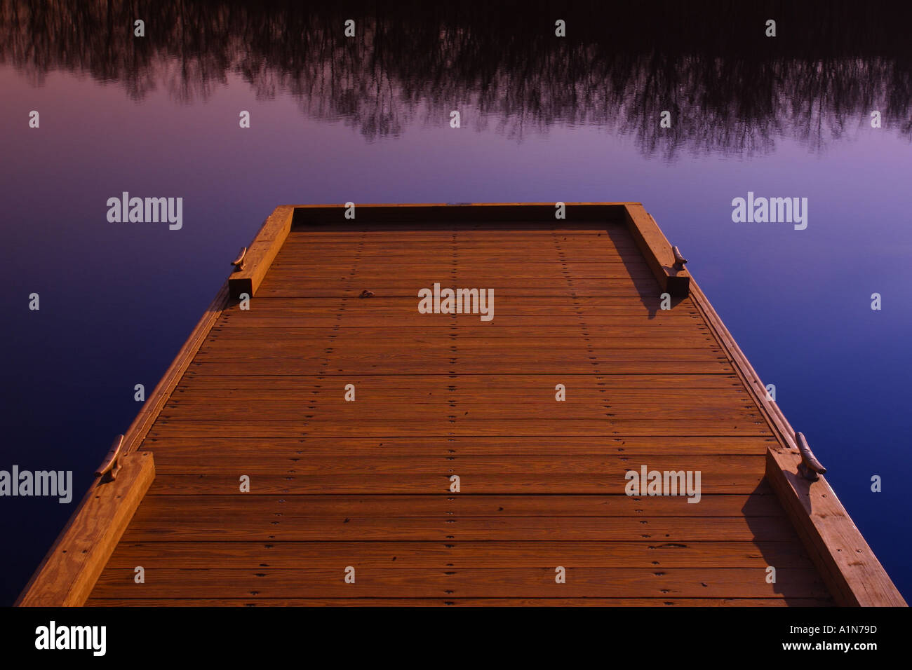 Empty boat dock at sunrise Stock Photo - Alamy