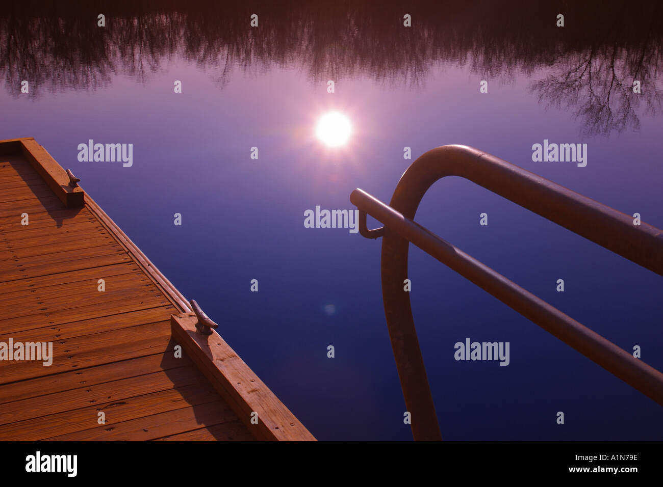 Empty boat dock at sunrise Stock Photo - Alamy