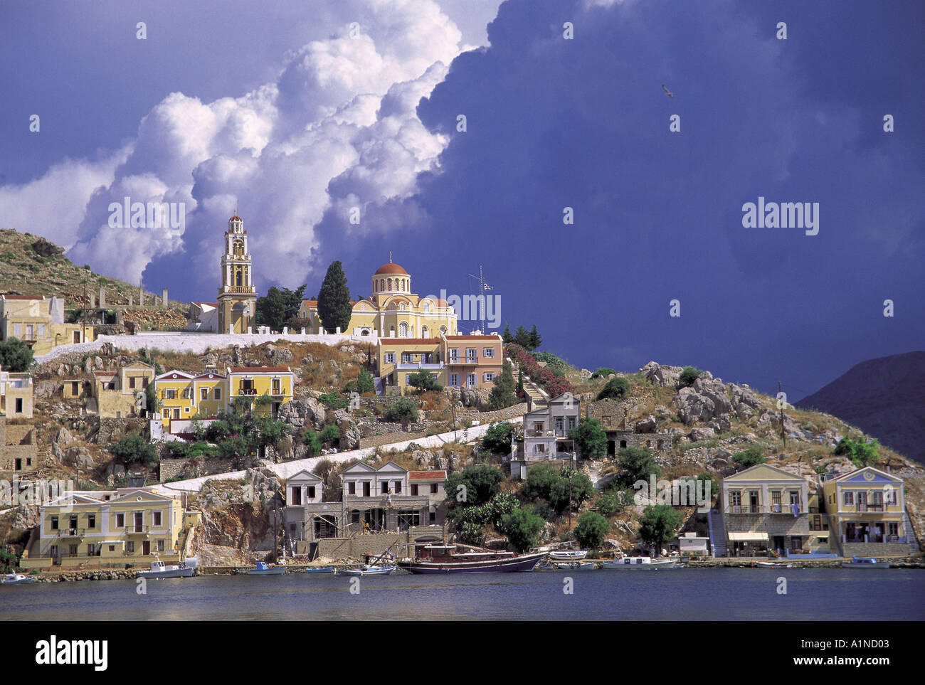 Greek orthodox church overlooks the entrance to Symi Stock Photo - Alamy