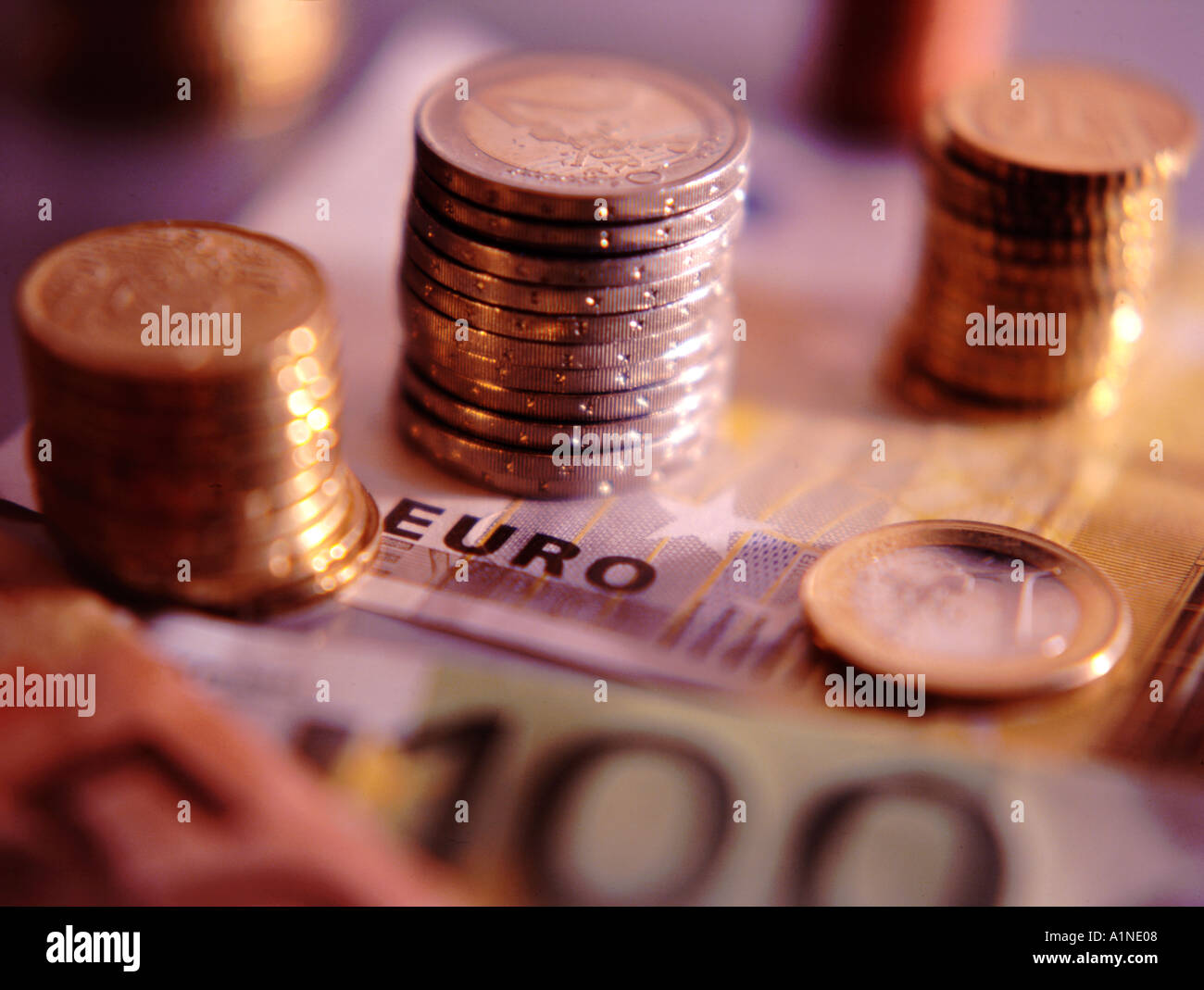 Euro bank note and coins Stock Photo - Alamy