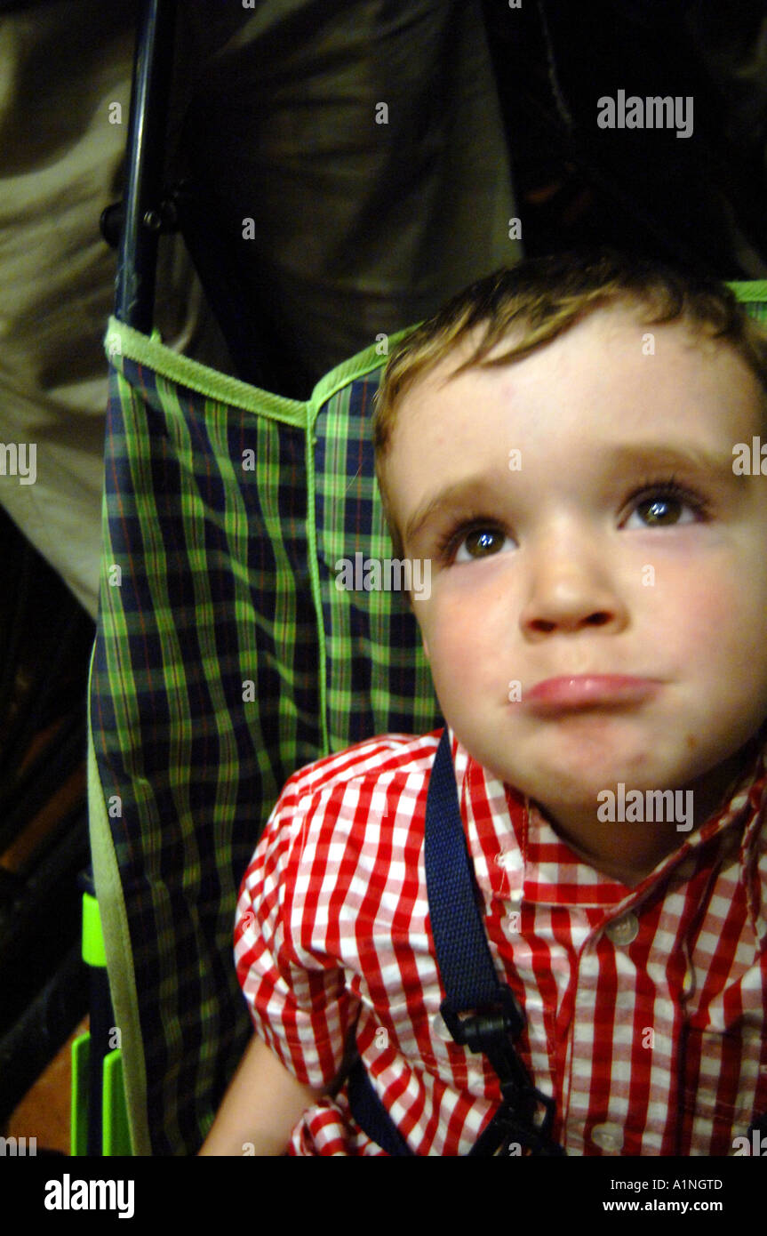 boy toddler child kid pram face head pushchair caucasian white vertical ...