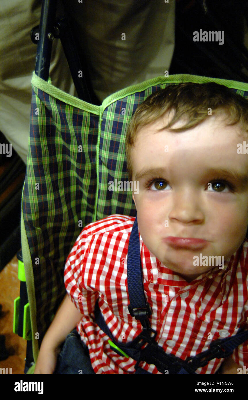 boy toddler child kid pram face head pushchair caucasian white vertical ...