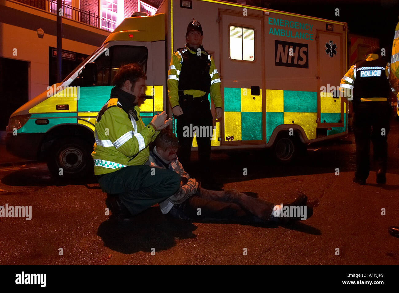 Paramedics help a young man who lays unconscious outside a Hull club ...