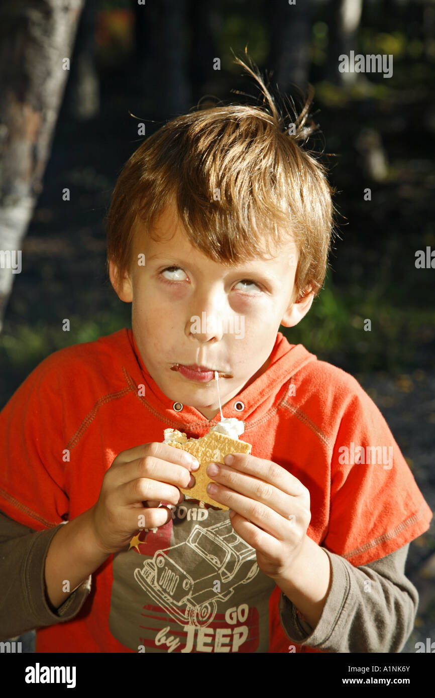Boy eating smores hi-res stock photography and images - Alamy