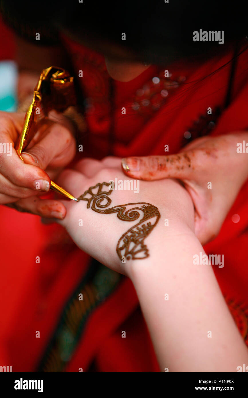 Applying henna at a Mela held in Swindon, Wiltshire, England Stock ...