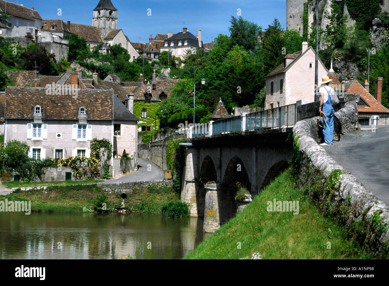 A Visitor Views the Medieval Village of Angles sur l'Anglin Stock Photo ...