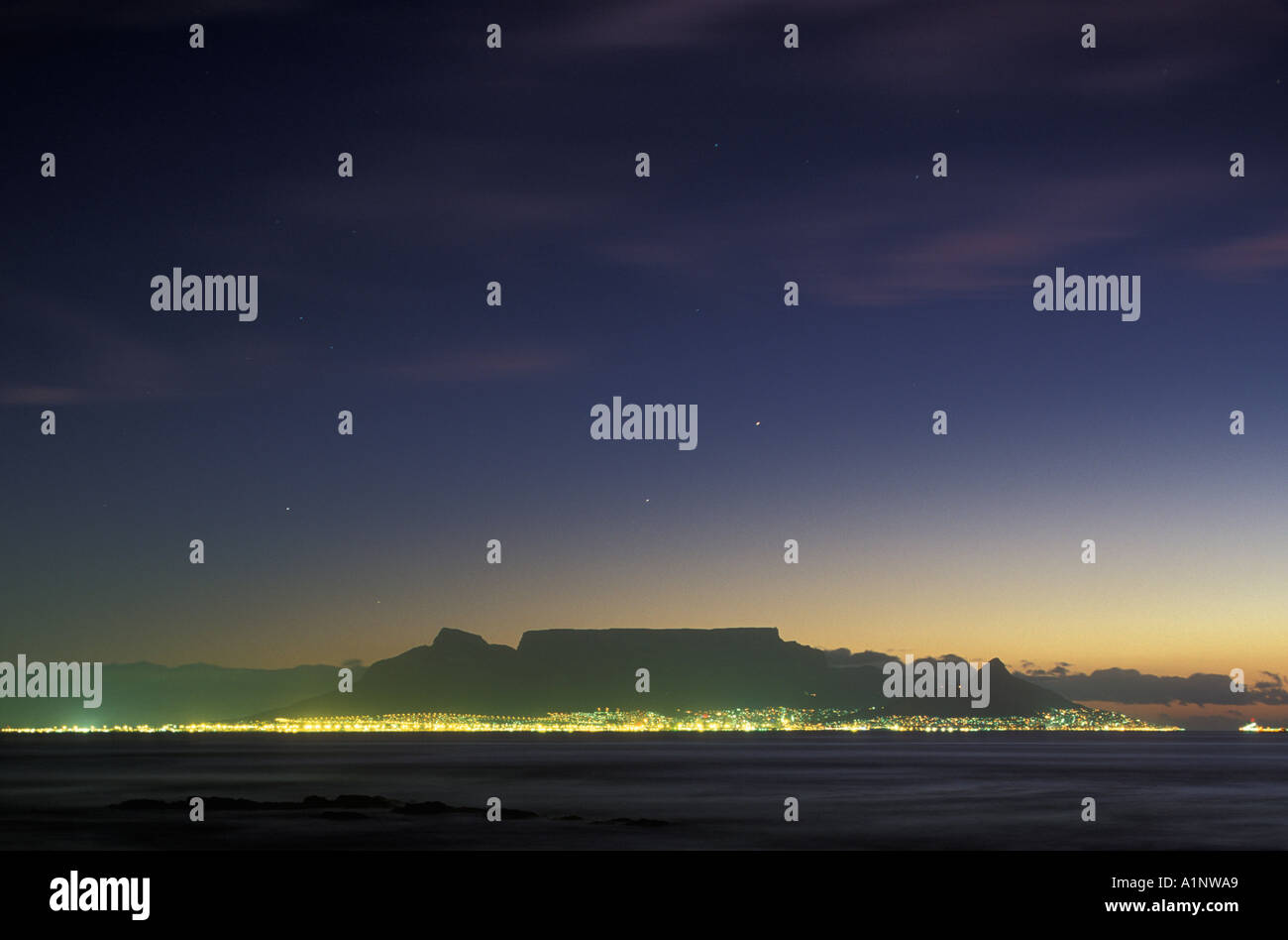 South Africa City lights of Cape Town shine under Table Mountain view ...