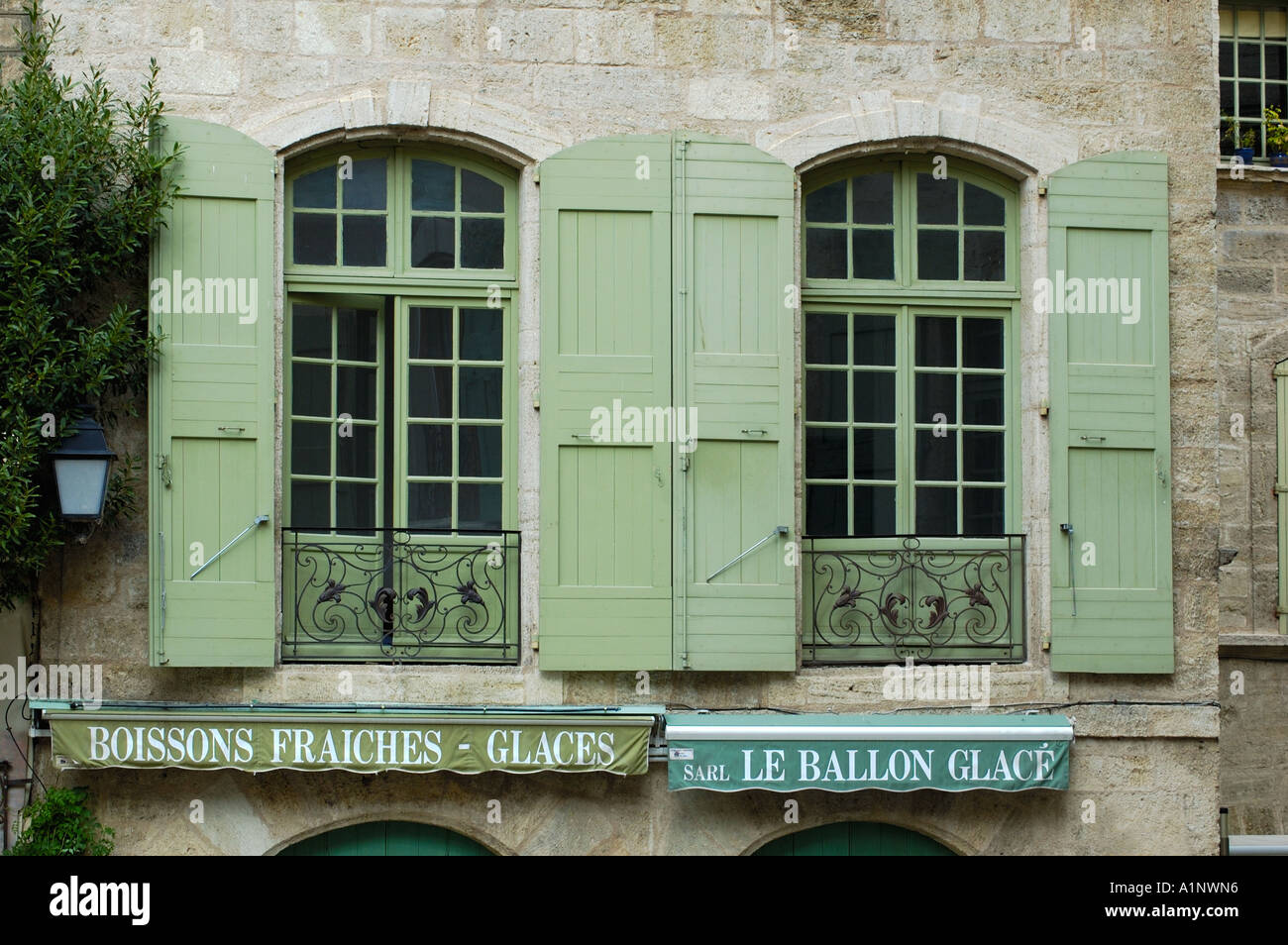 elegant green window frames and shutters Pezenas Languedoc France Stock ...