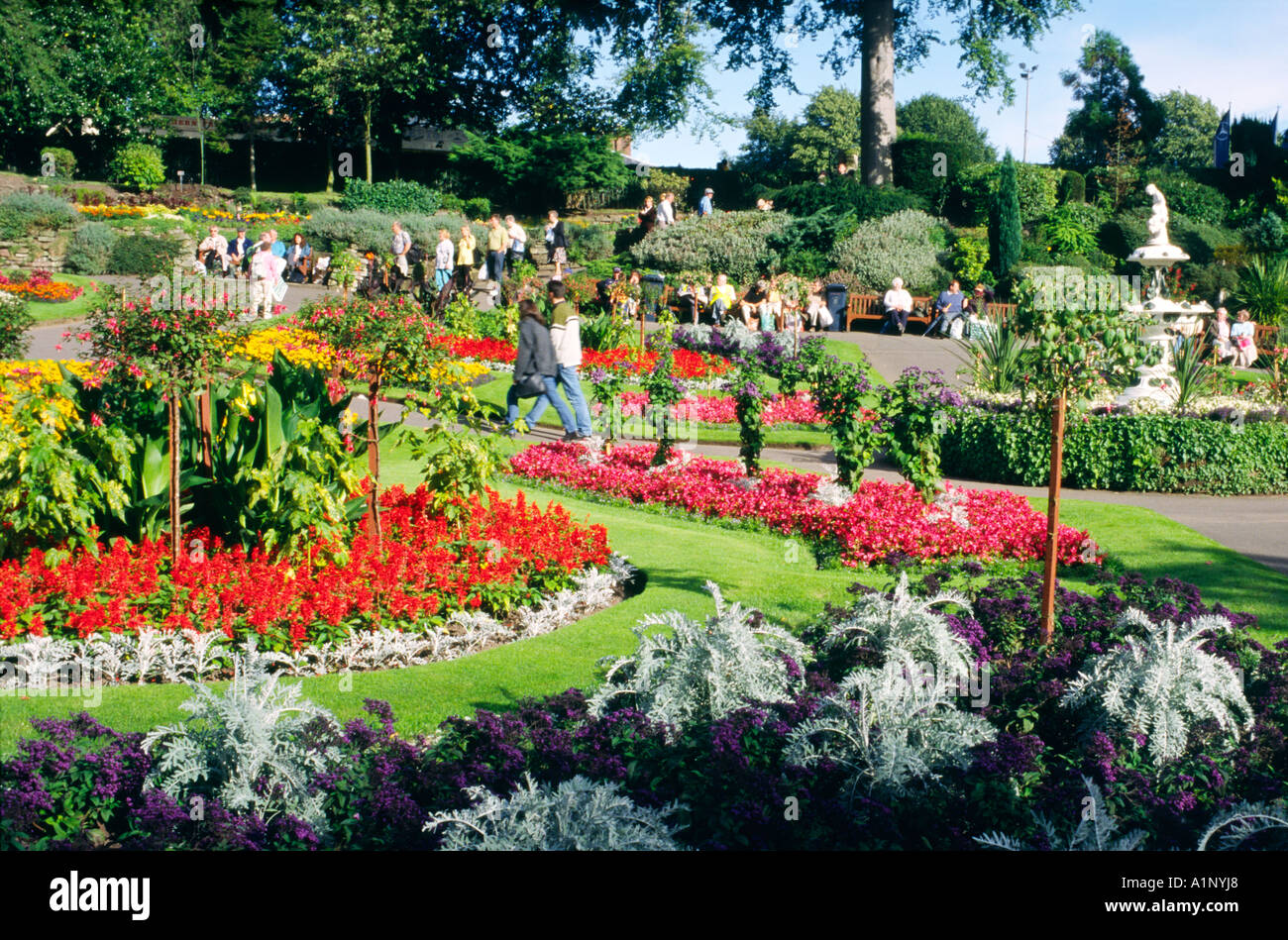 The flower gardens, ponds and fountains of the town park known as The ...