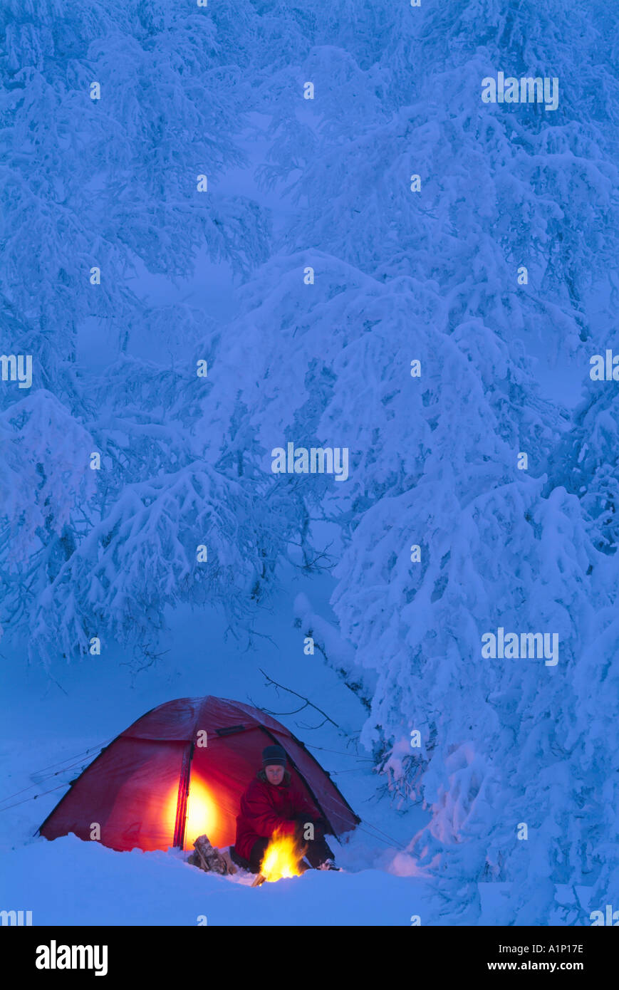 Sitting campfire tents hi-res stock photography and images - Alamy