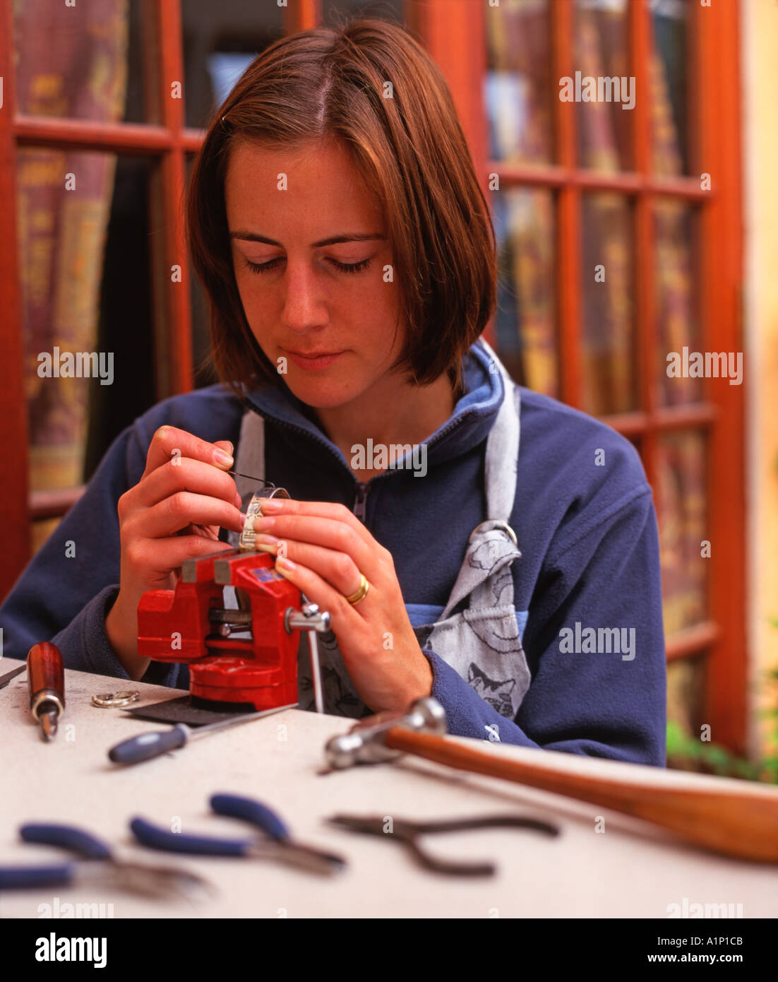 Young woman silversmith Stock Photo - Alamy