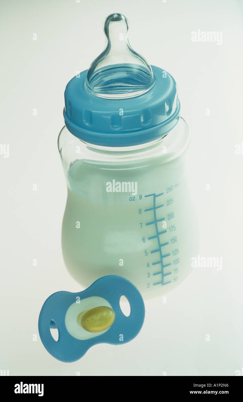 Babies bottle and dummy Stock Photo - Alamy