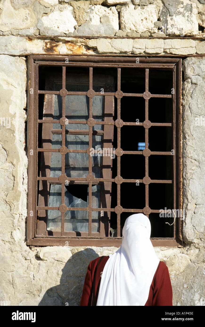 Woman looking through a Window at Castle of Qaitbay Alexandria Egypt ...