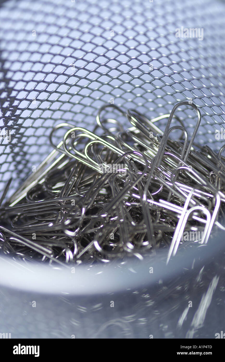 Paper clips in container Stock Photo - Alamy