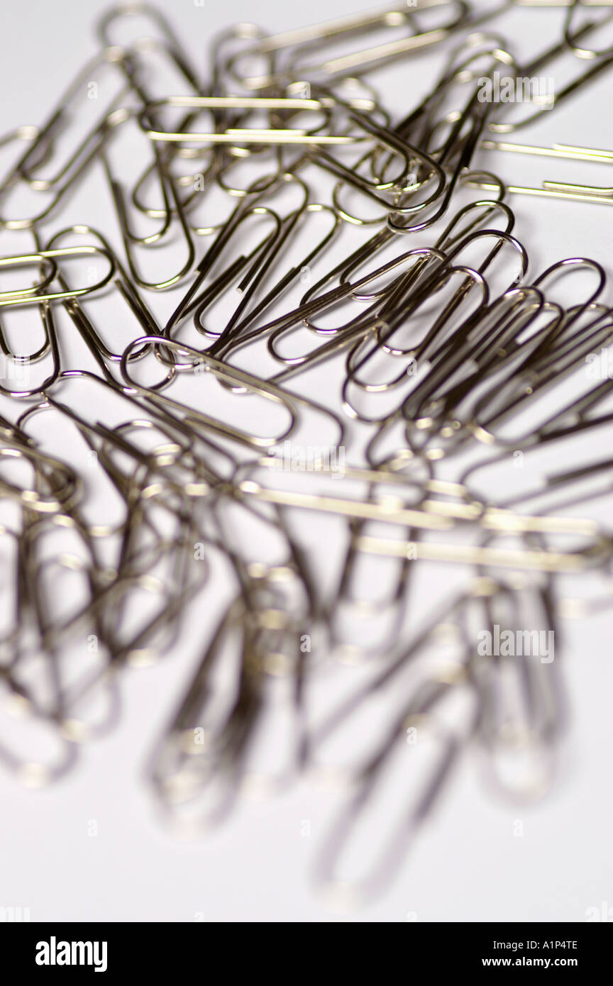Paper clips on white background Stock Photo - Alamy