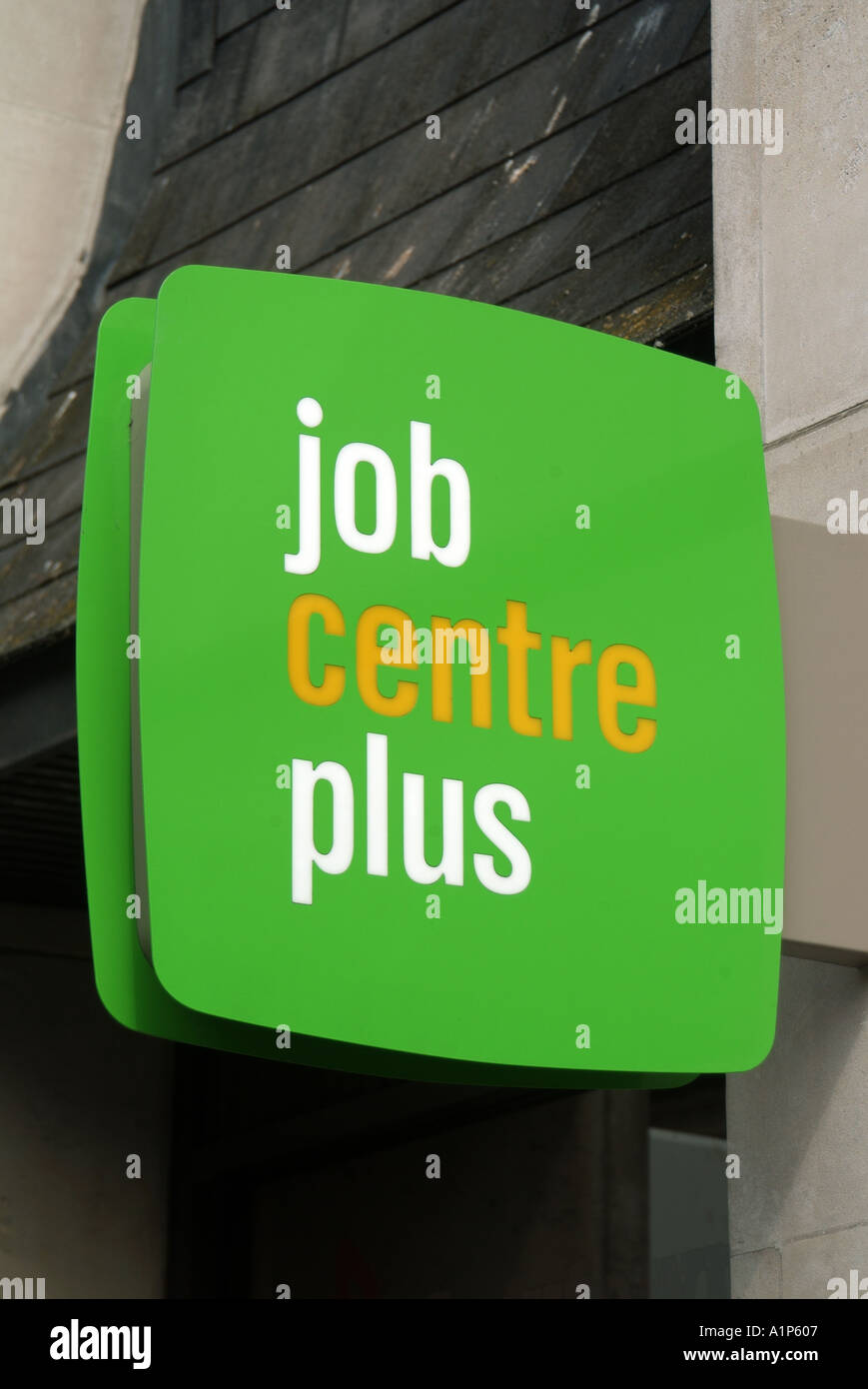 Standard sign hanging from wall outside employment labour exchange with ...