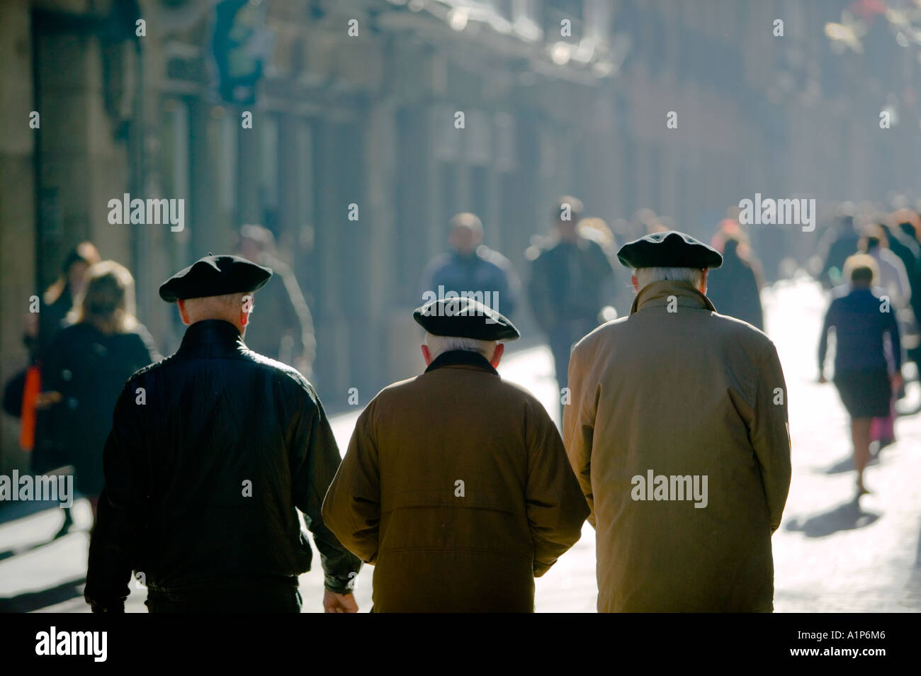 Three elderly gentlemen wearing black Basque berets walking in the ...