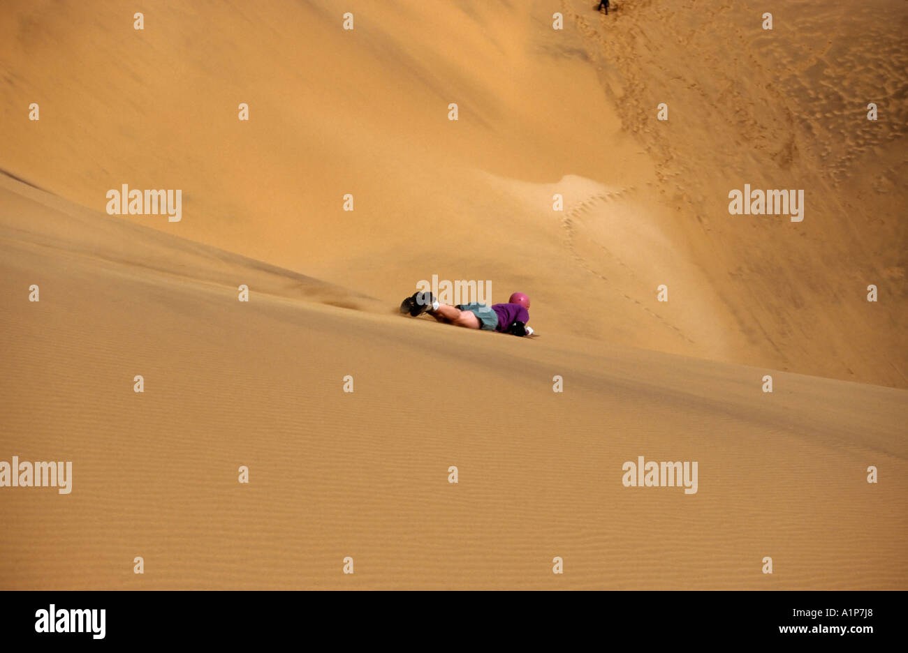 Sand boarding down the dunes, Swakopmund, Namibia Stock Photo - Alamy