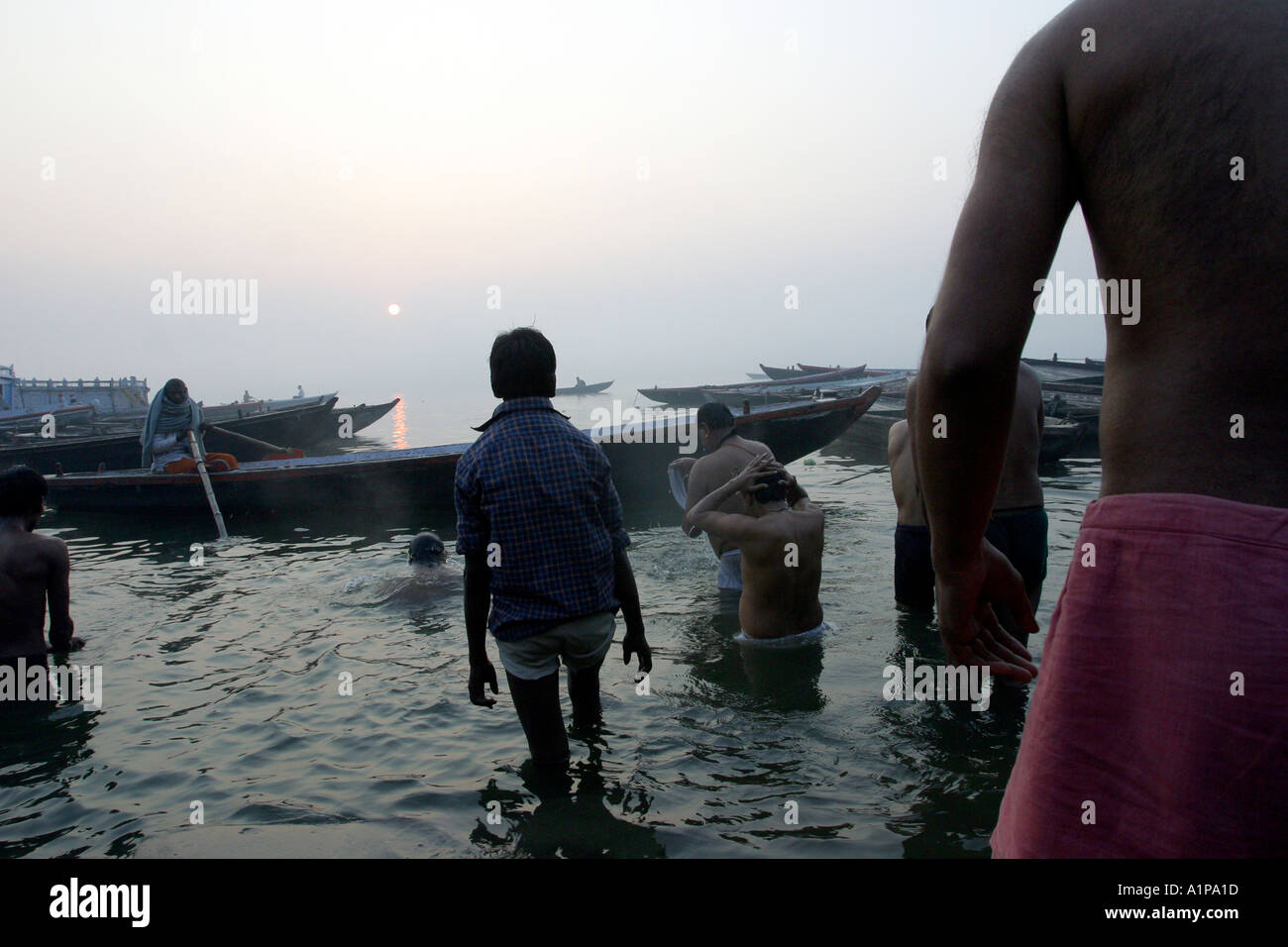 Men take a religious bath to clean their souls from past sins in the ...