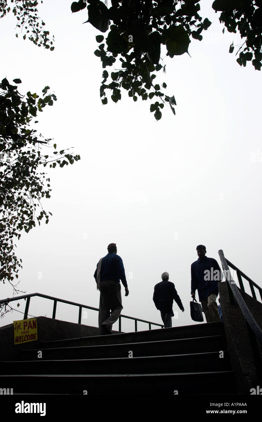 Pedestrians walk over a bridge in New Delhi in India Stock Photo - Alamy