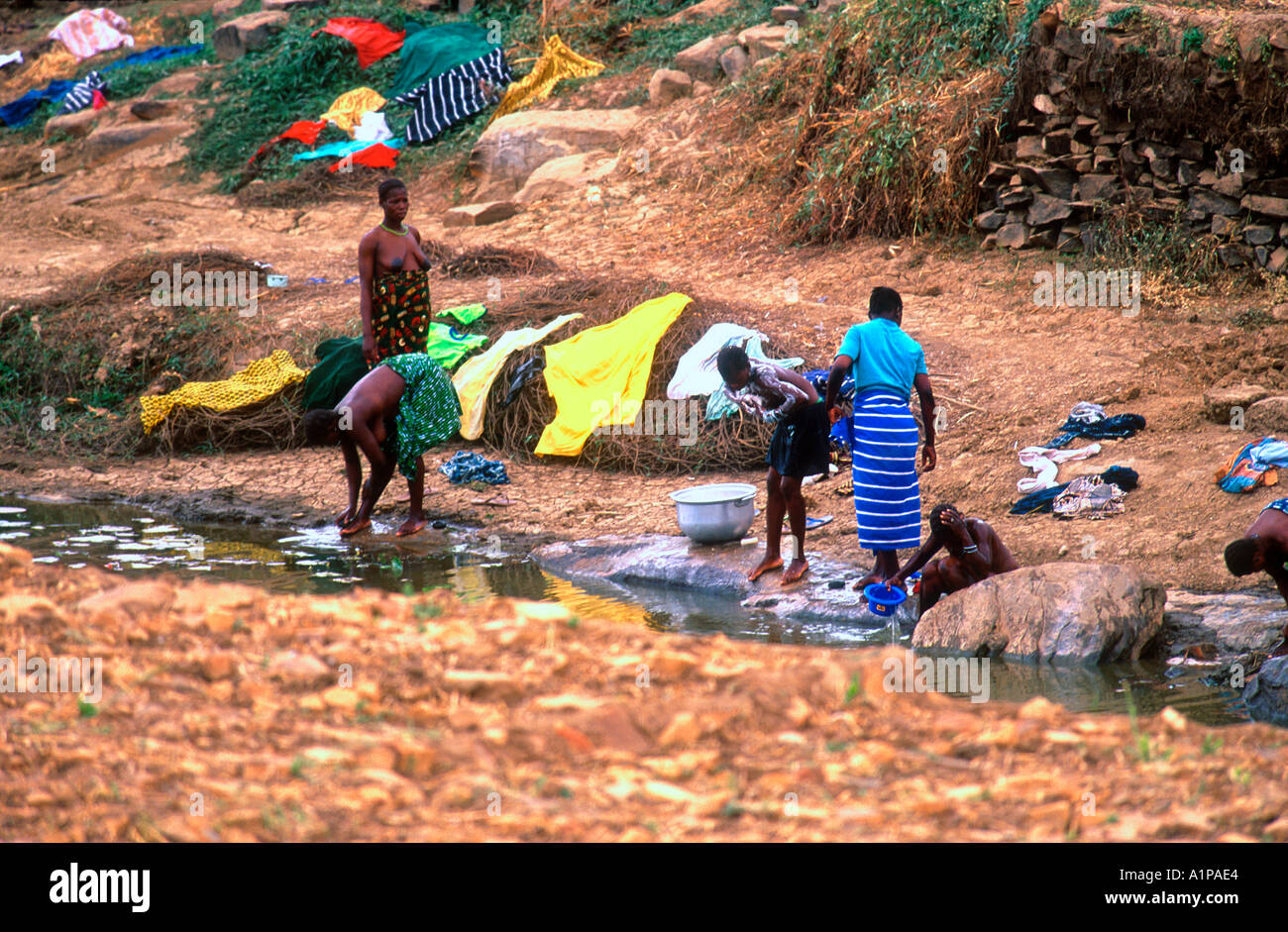 Dogon women washing in stream near Sangha Mali Stock Photo - Alamy