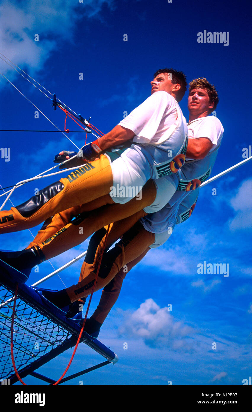 Eighteen foot skiff racing with crew of three on trapeze at Hayman ...