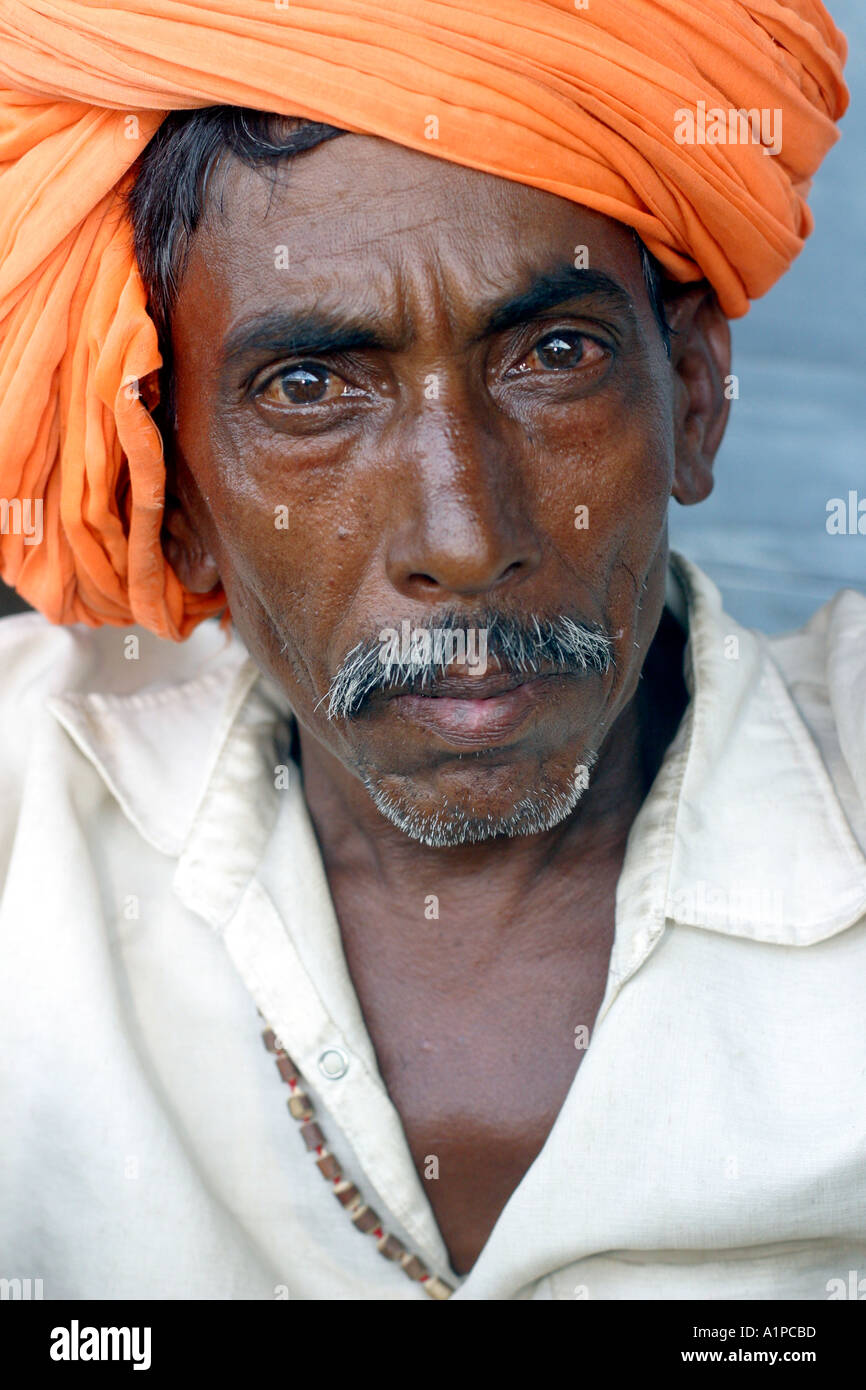 Portrait of an Indian man wearing an orange turban in India Stock Photo ...