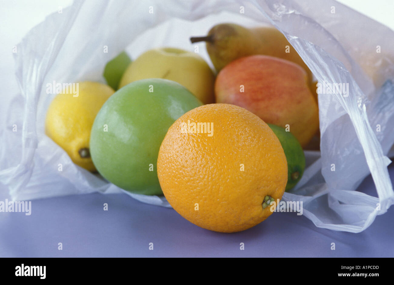 Fruit in plastic bag Stock Photo - Alamy