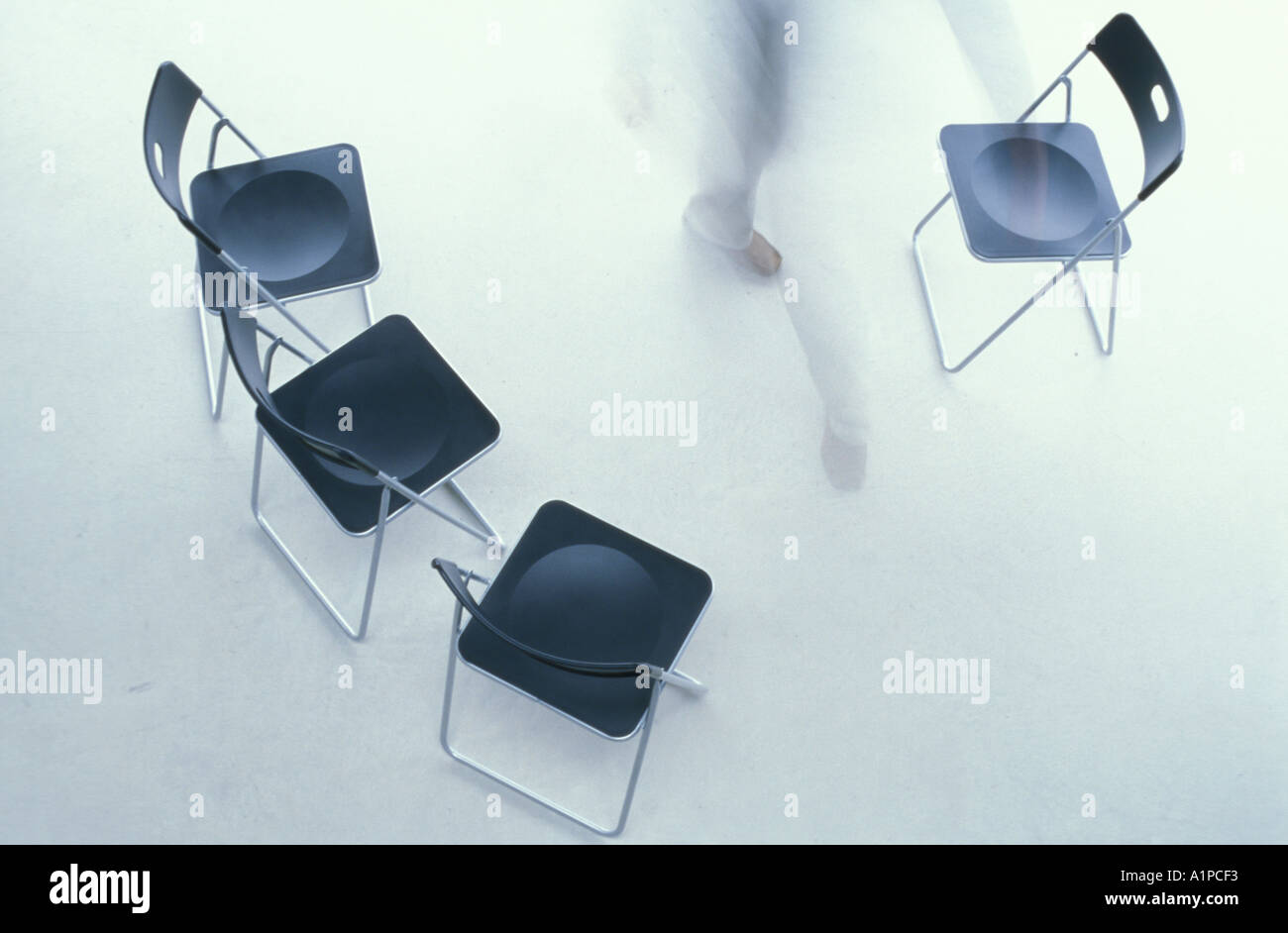 Man between chairs hi-res stock photography and images - Alamy