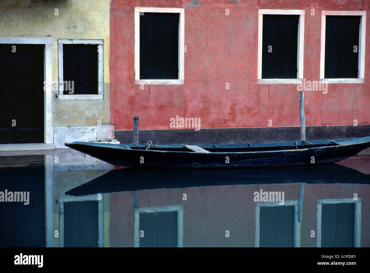 Torcello Island, Lagoon of Venice. A typical Sandolo boat moored at the ...