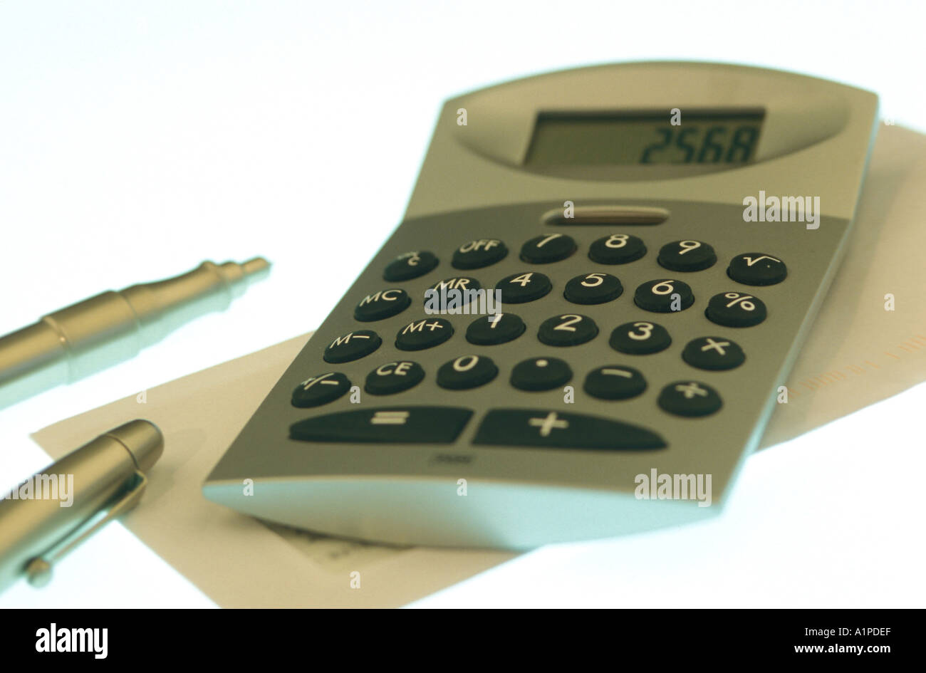 Pocket calculator and pencil Stock Photo - Alamy
