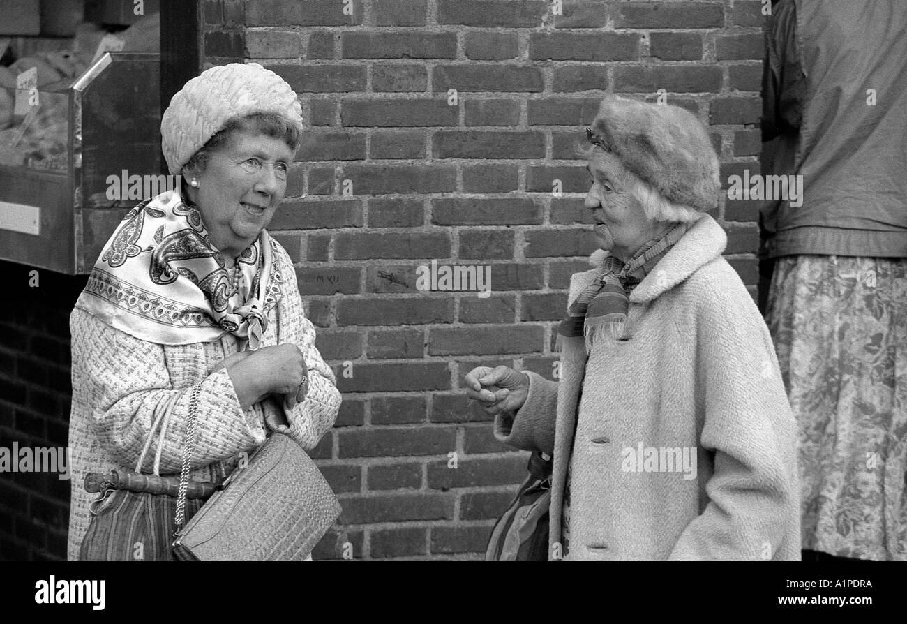 Chatting two Black and White Stock Photos & Images - Alamy