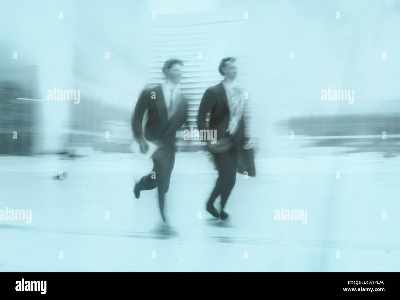 Businessmen running blurred Stock Photo - Alamy