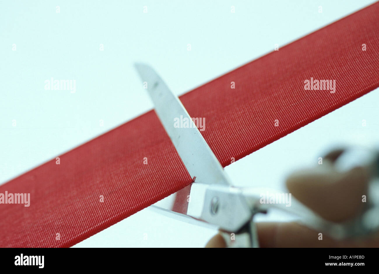 Scissor cutting image hi-res stock photography and images - Alamy