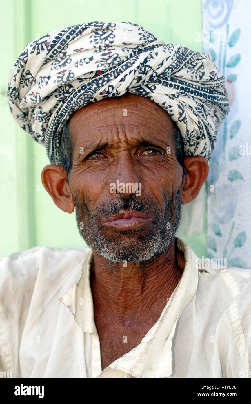 A portrait of an Indian man wearing a turban in the ciy of Udaipur in ...
