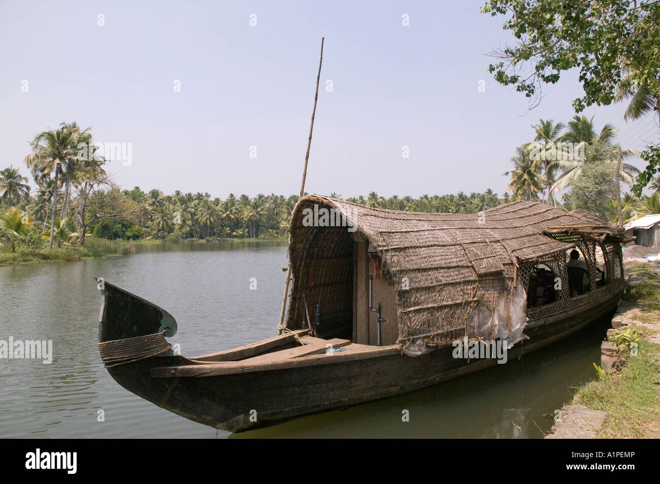 A touring boat on the riverbank in Kerala India Stock Photo - Alamy