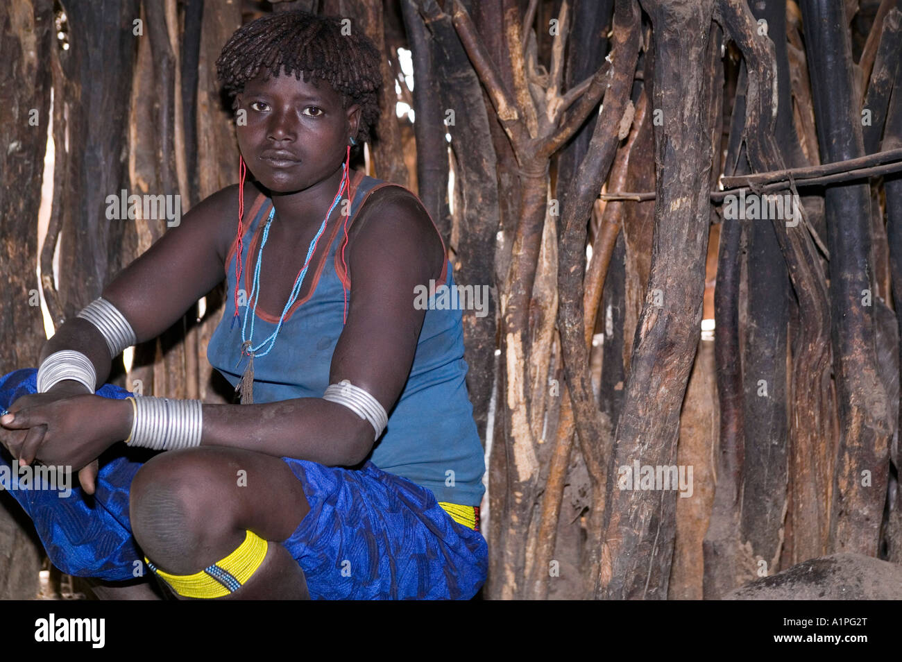 A Tsemai woman sitting in her hut in Zegerma village in southern ...