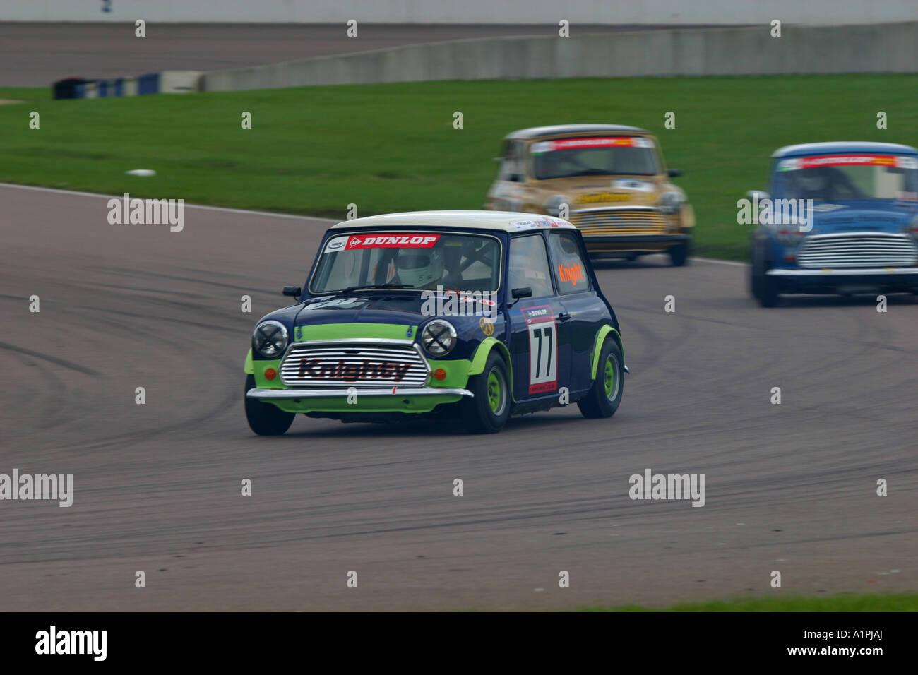 Mini Racing Cars racing around a circuit Stock Photo - Alamy